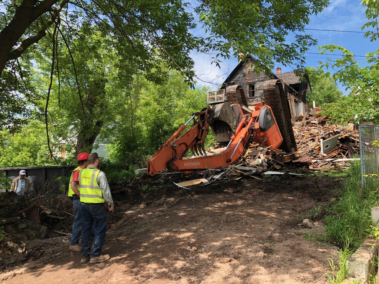 Excavator Flipped During Demolition, no Injuries Reported - Fox21Online