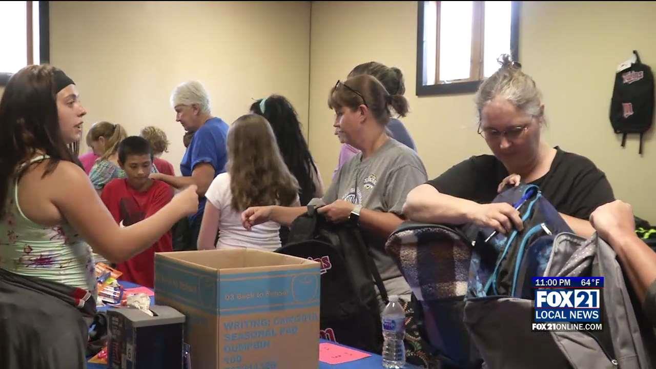 Volunteers Fill Backpacks For School Children - Fox21Online