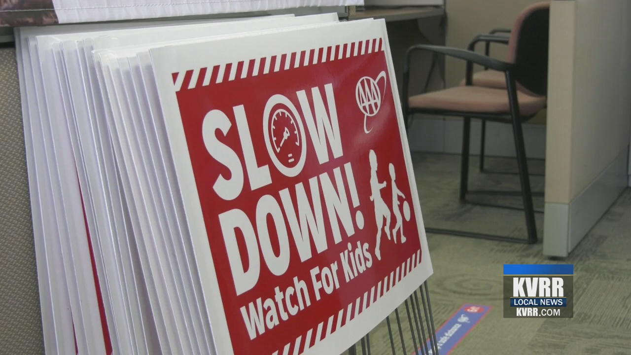 AAA hands out yard signs to remind people to keep safe on the roads ...