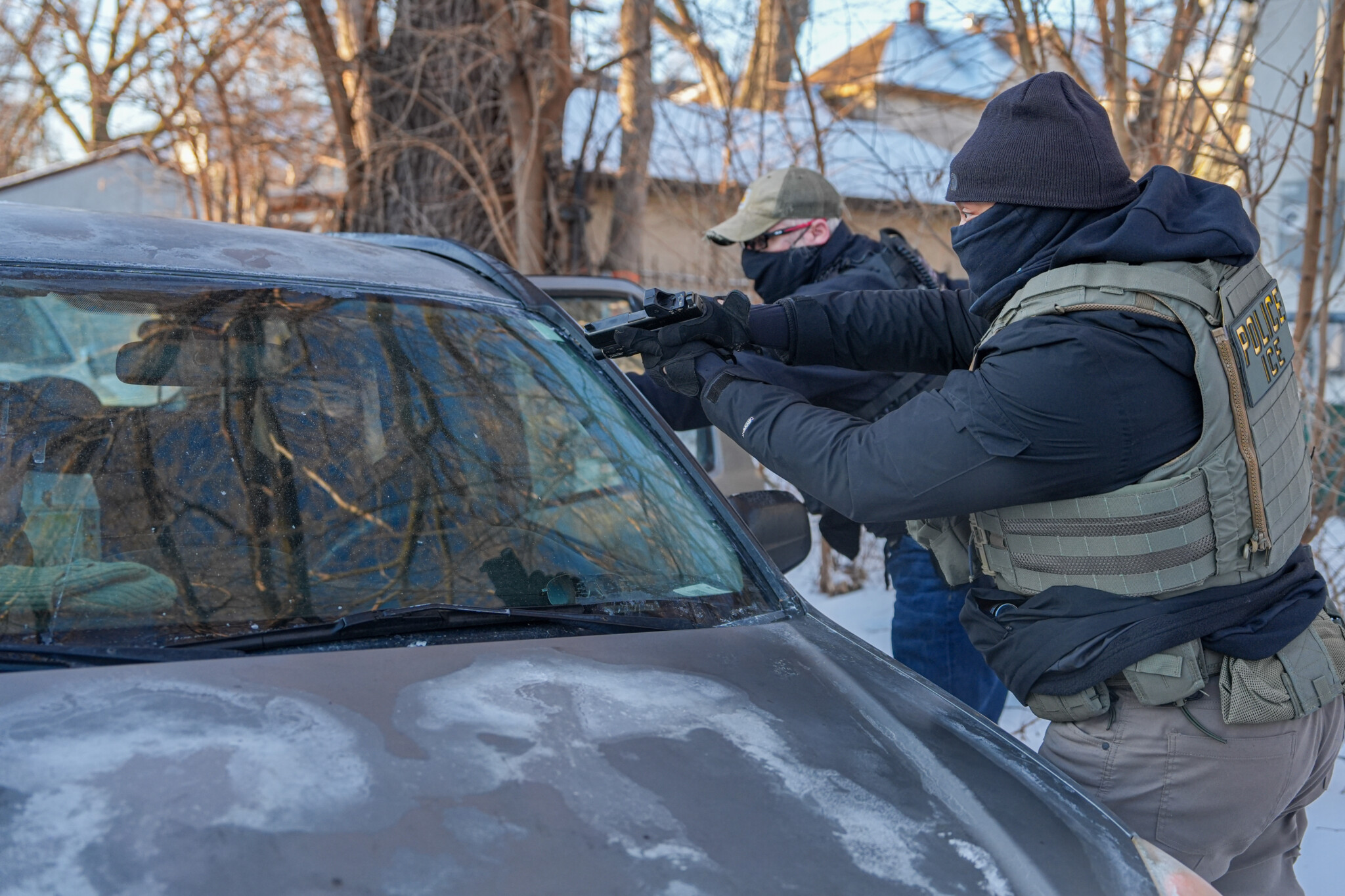 Immigration agents draw guns and arrest activists following them in ...