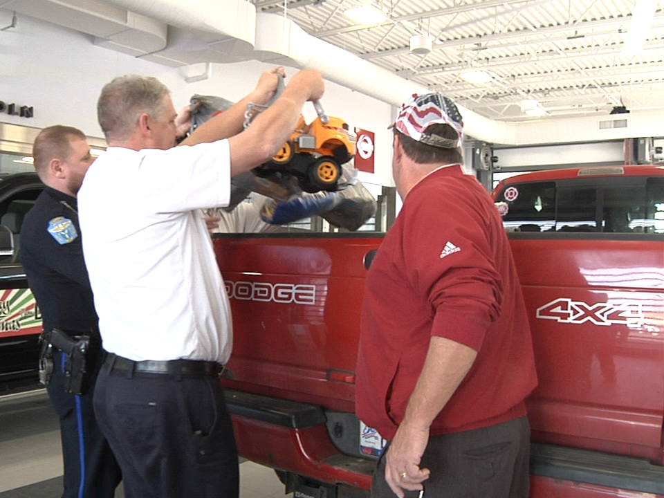Dutro Ford, Zanesville PD and Fire partner for toy drive - WHIZ - Fox 5 ...